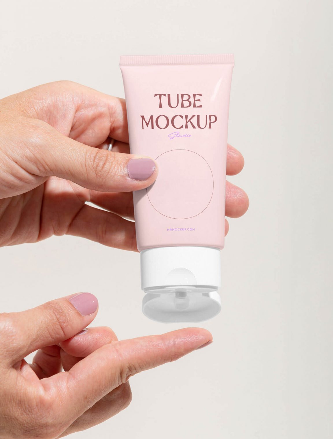 Free Hand Holding Beauty Cream Tube Mockup - Free Package Mockup